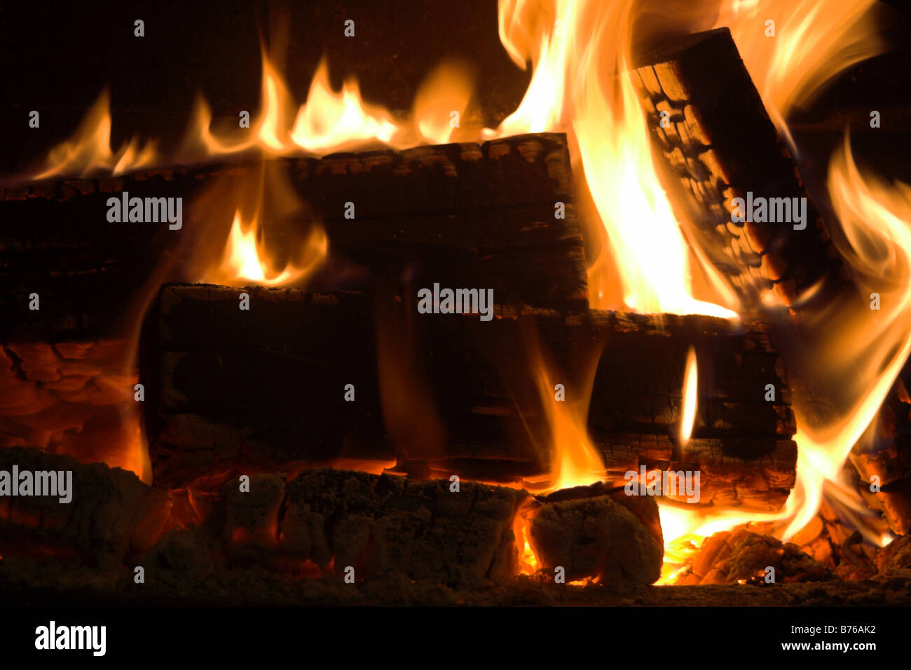Pallet wood burning in wood burning stove Stock Photo - Alamy