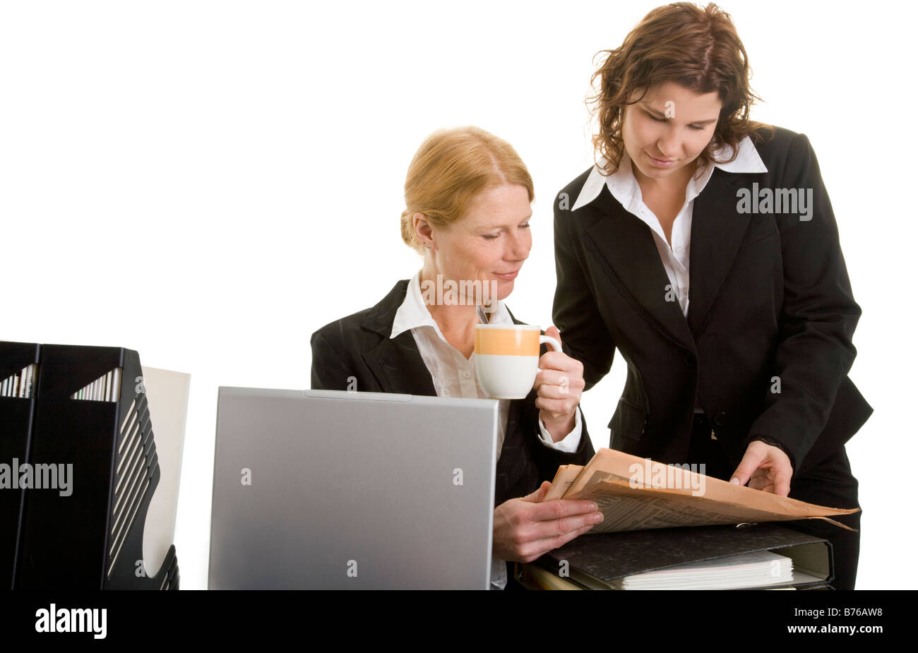 two successfully businesswoman reading the newspaper Stock Photo - Alamy two successfully businesswoman reading the newspaper Stock Photo - Alamy
