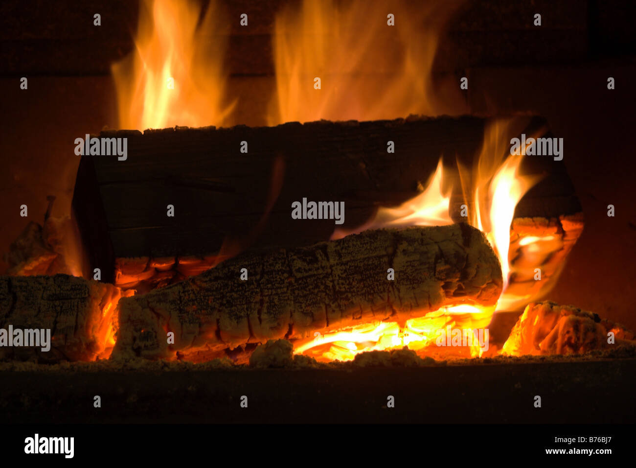 Pallet wood burning in wood burning stove Stock Photo - Alamy
