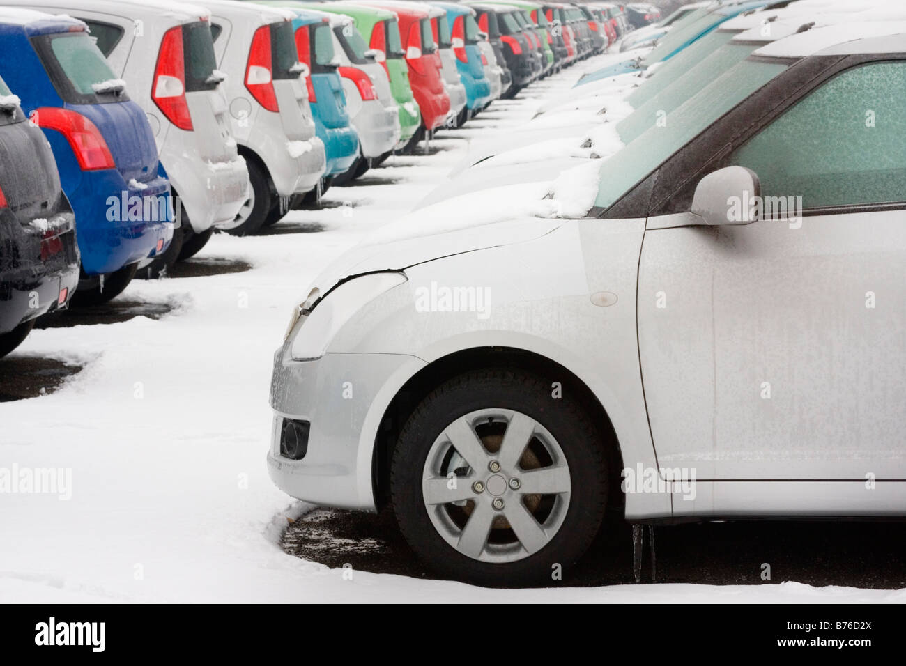 Stocked cars covered with snow in winter Stock Photo - Alamy