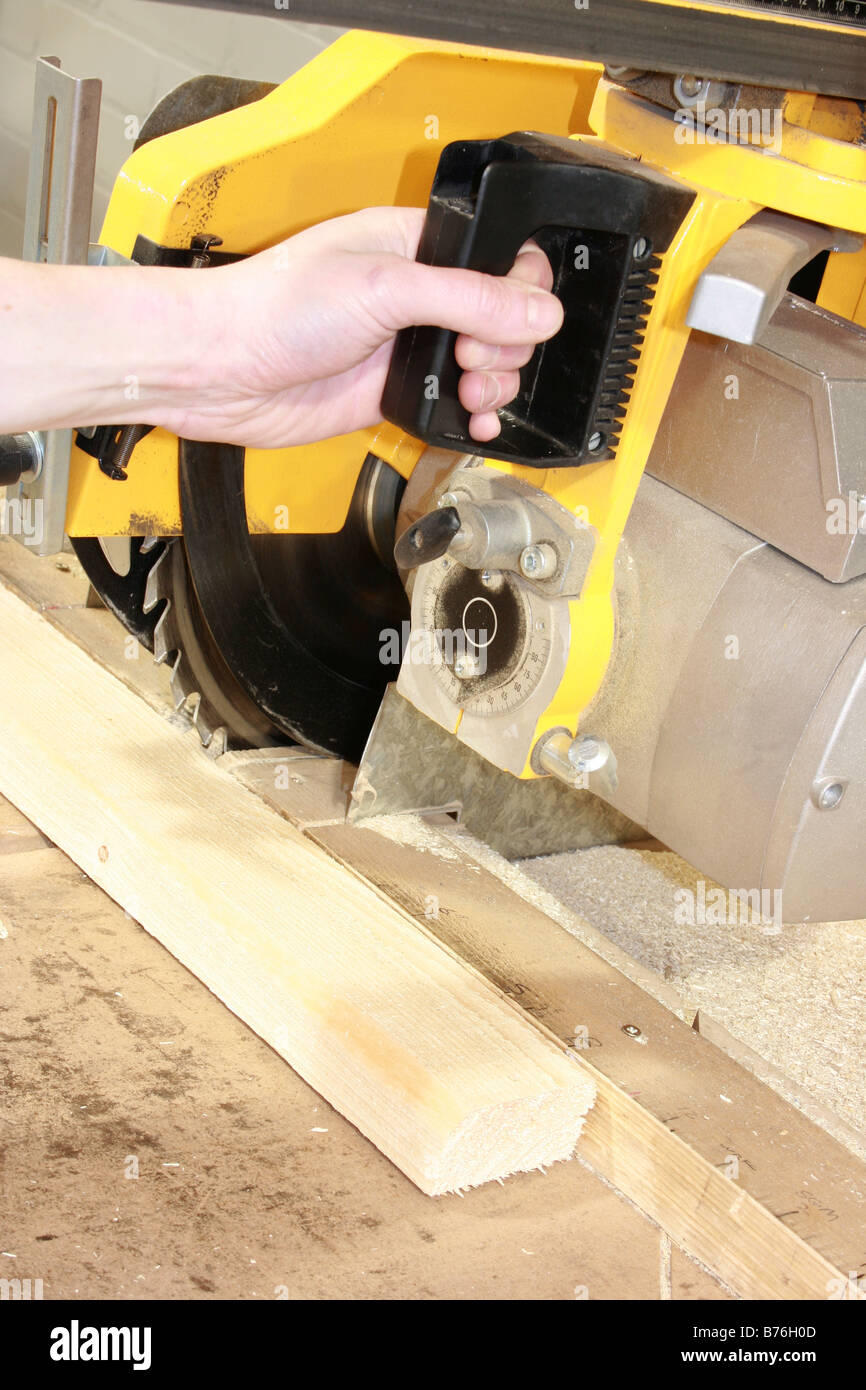 Man operating a large table saw Stock Photo - Alamy