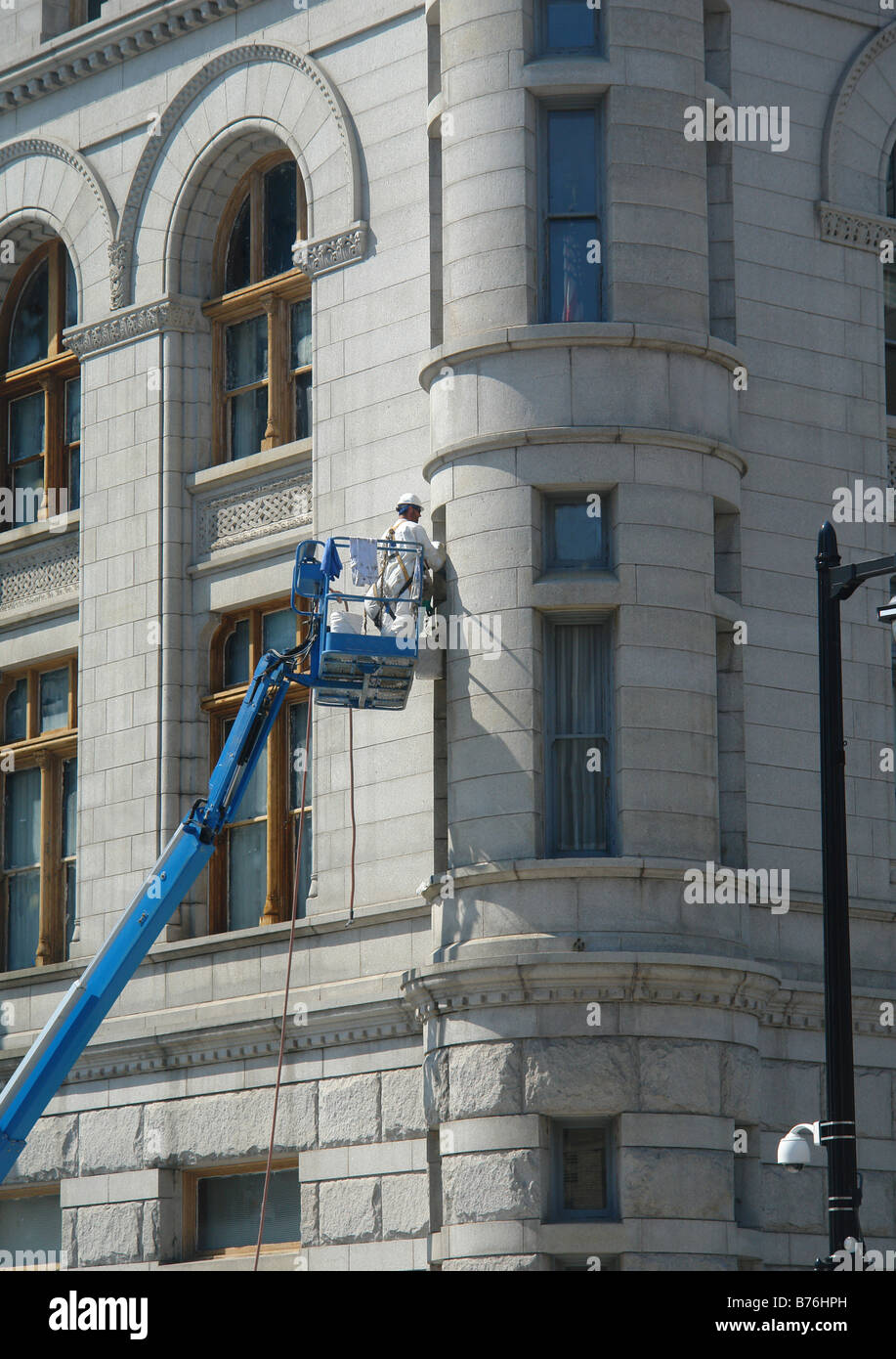 City Worker remodeling building Stock Photo - Alamy
