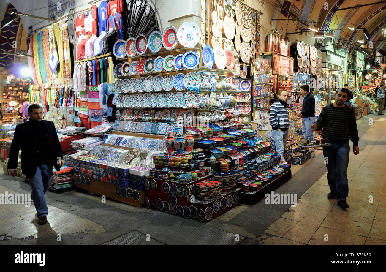 Two local Turkish men walk through the colourful alleyways of the Grand ...
