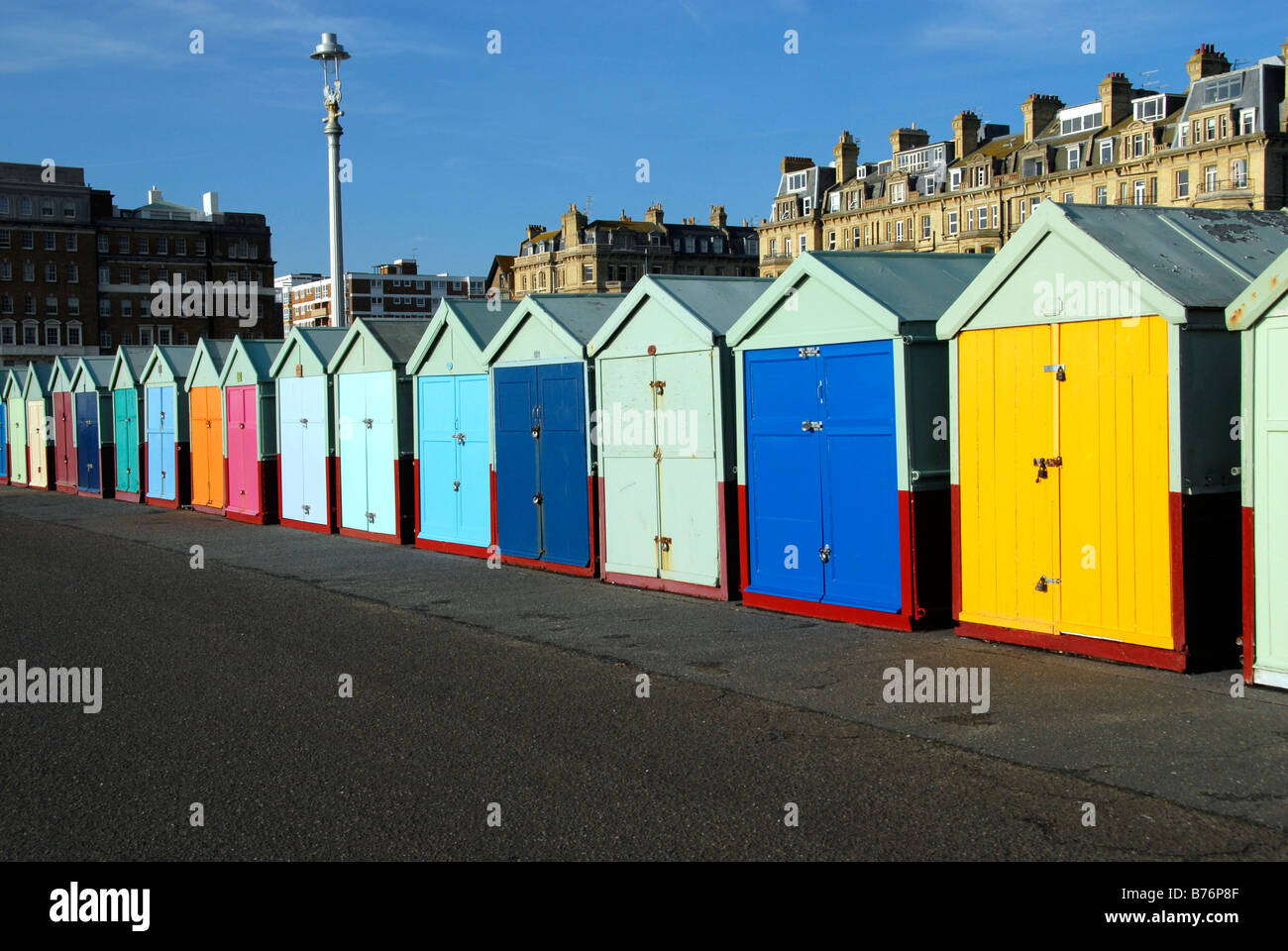 Colourful beach huts on the sea front esplanade Brighton UK Stock Photo ...