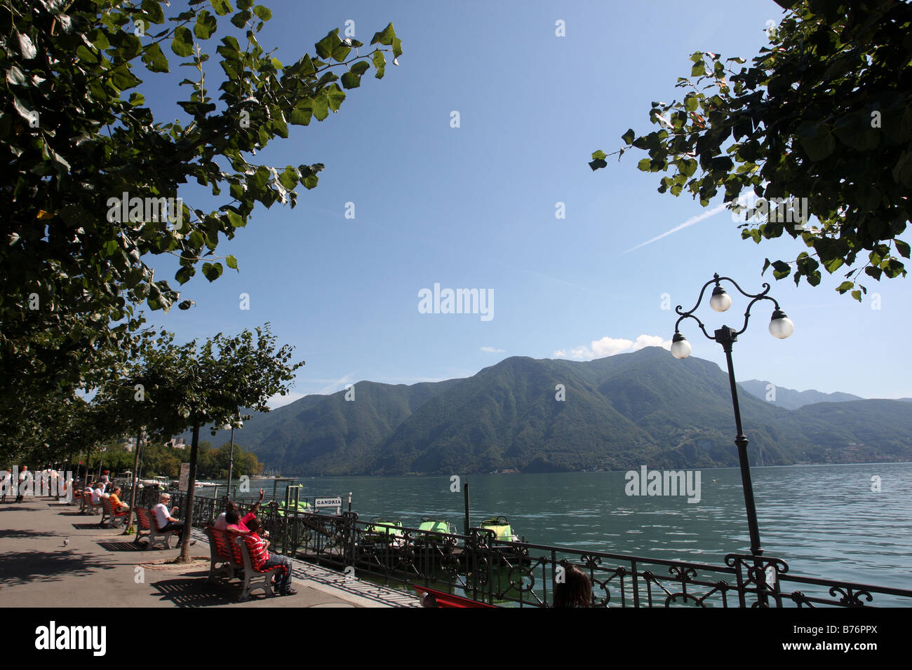 Lakeside promenade in the town of Lugano on the shores of Lake Lugano ...