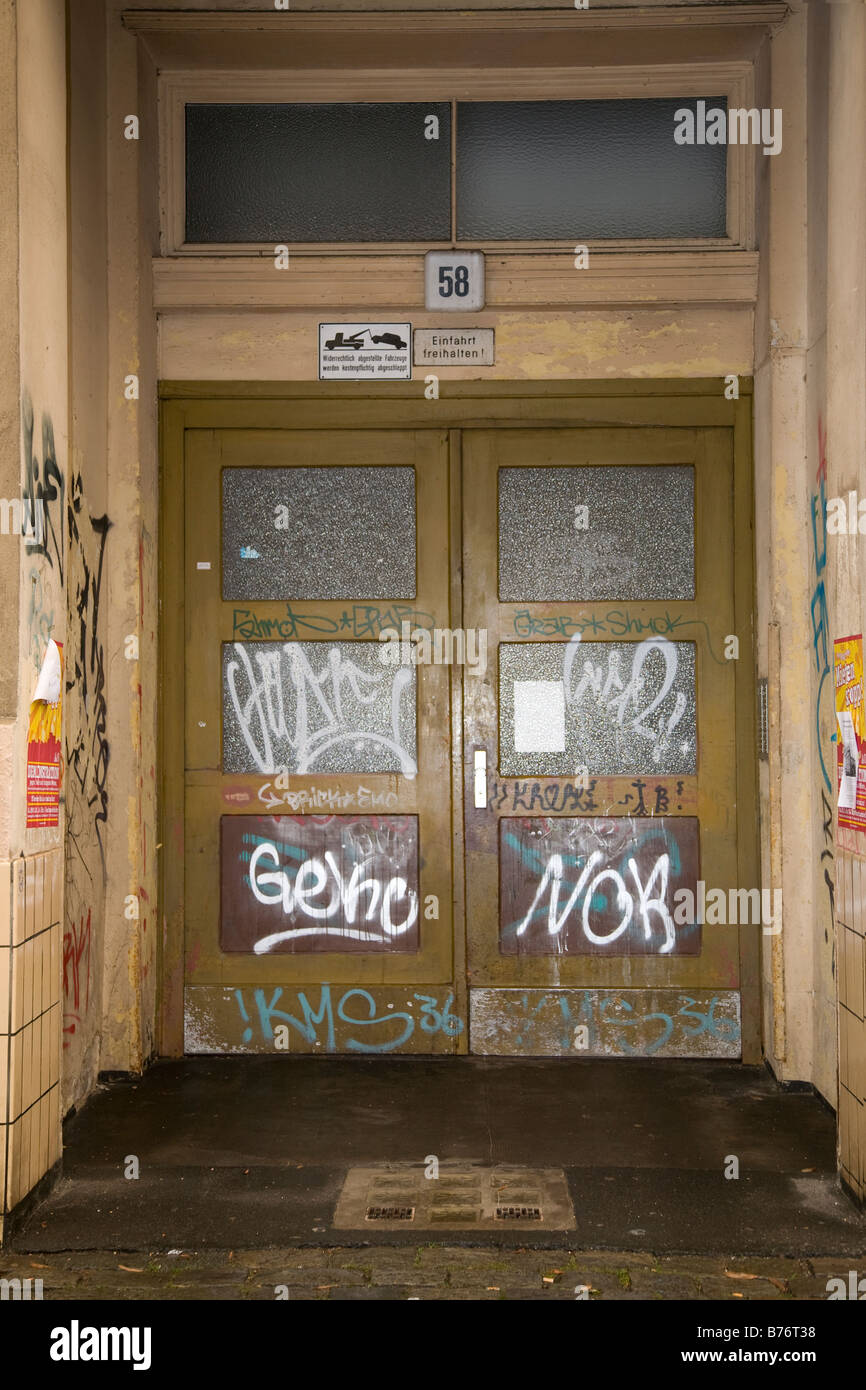 Graffiti in Apartment block doorway Stock Photo - Alamy
