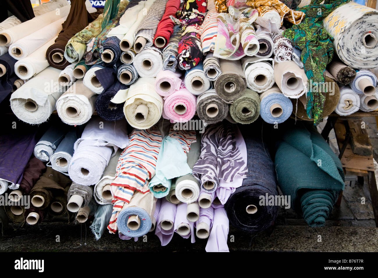 Rolls of material at a market Stock Photo - Alamy