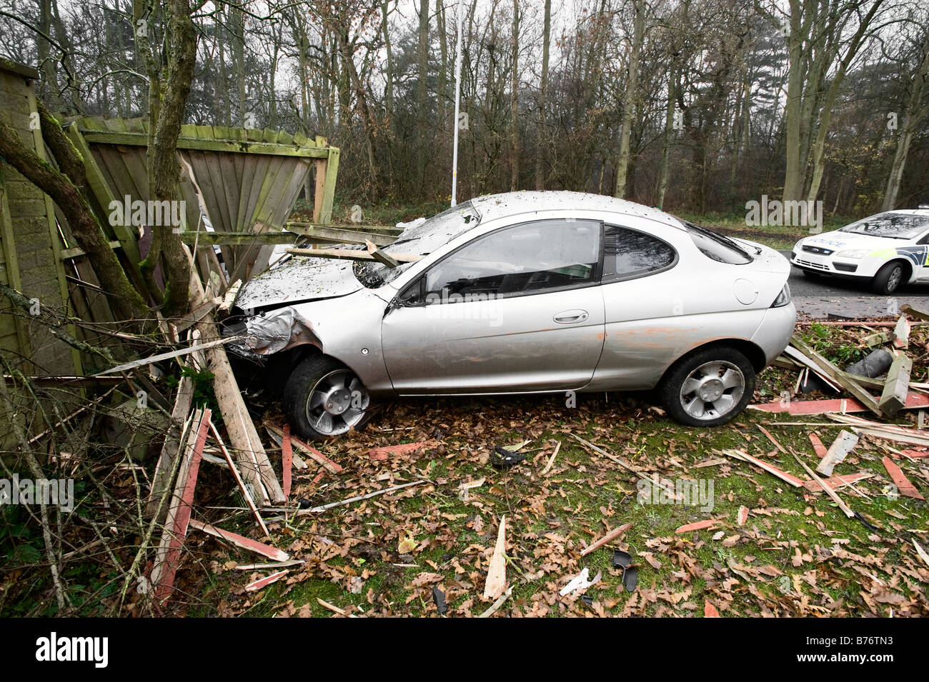Car crashed through a fence into a garden Stock Photo - Alamy