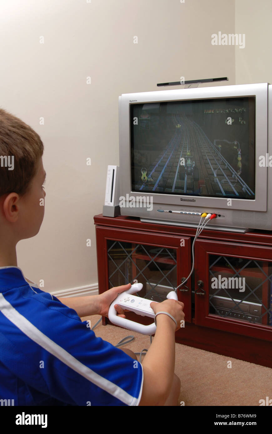 a young boy playing on wii console Stock Photo - Alamy