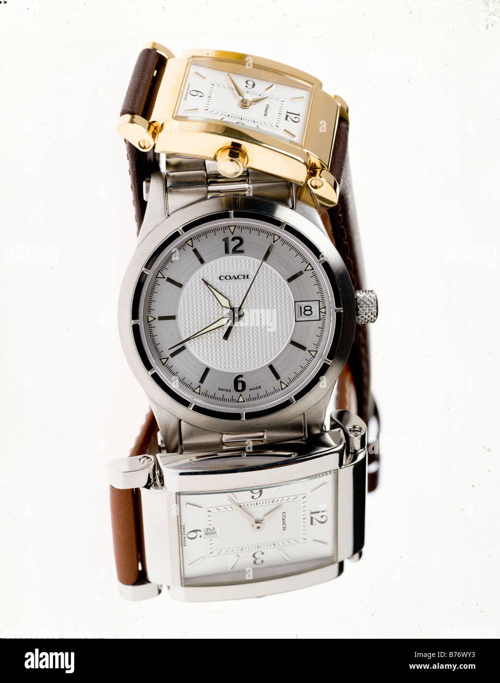 Silver 3 watch faces tower stacked arrange hi-res stock photography and ...