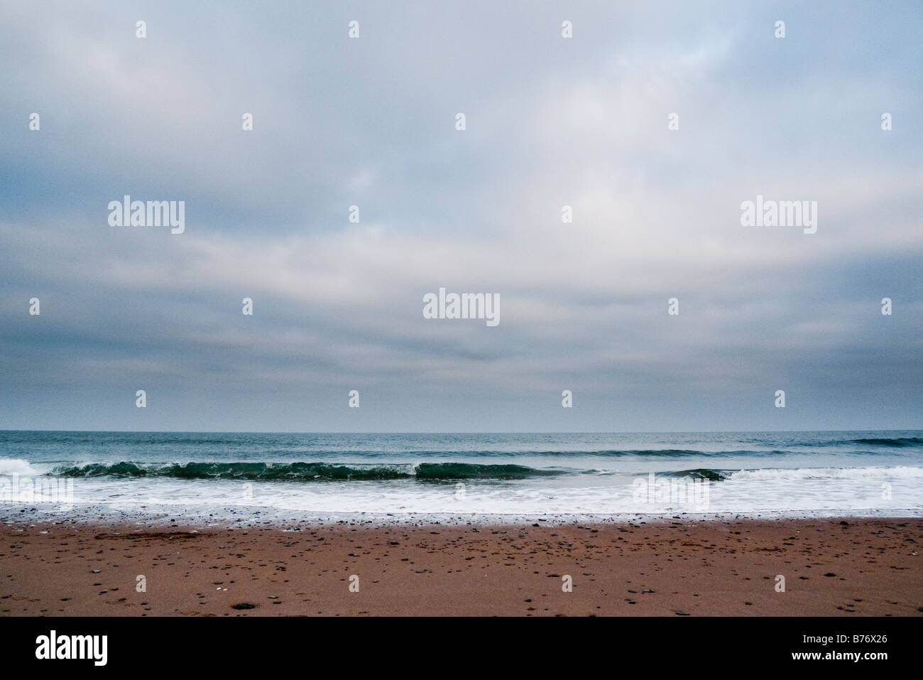 Waves lapping on shore Stock Photo - Alamy