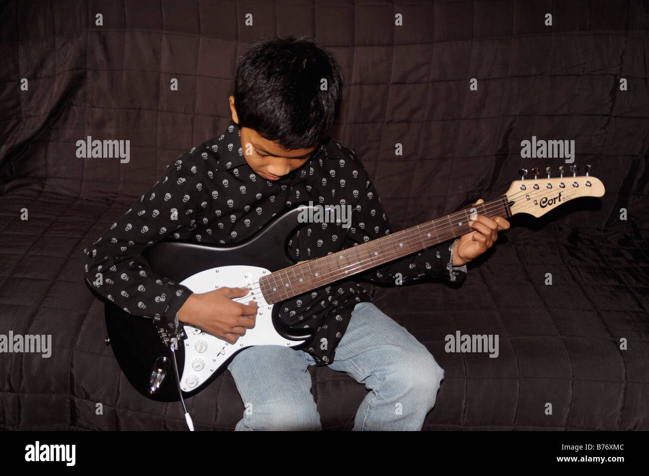 boy play electric guitar Stock Photo - Alamy