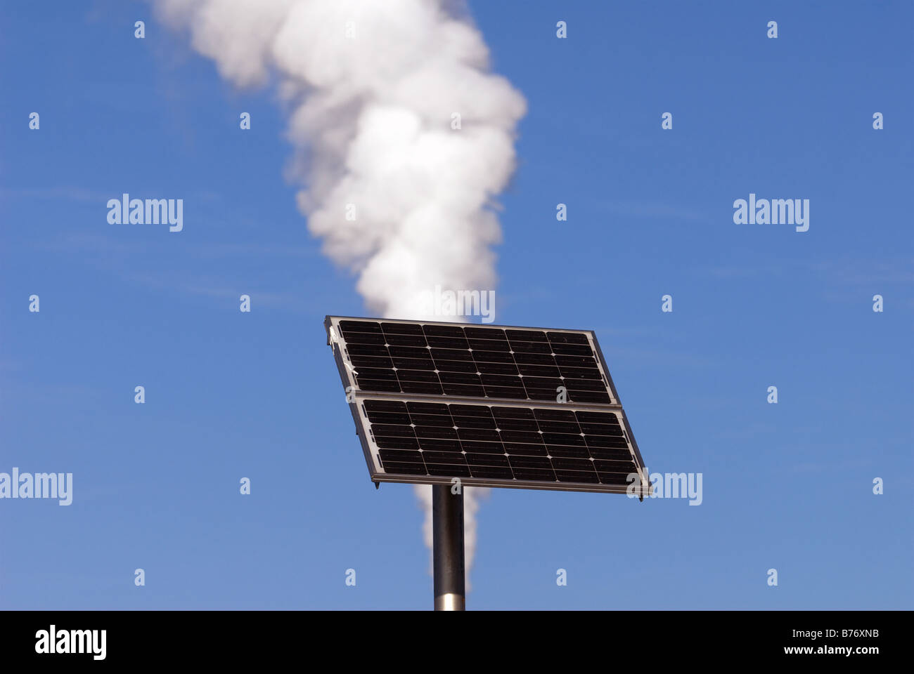 Solar panel close to the chimney of a commercial waste disposal ...