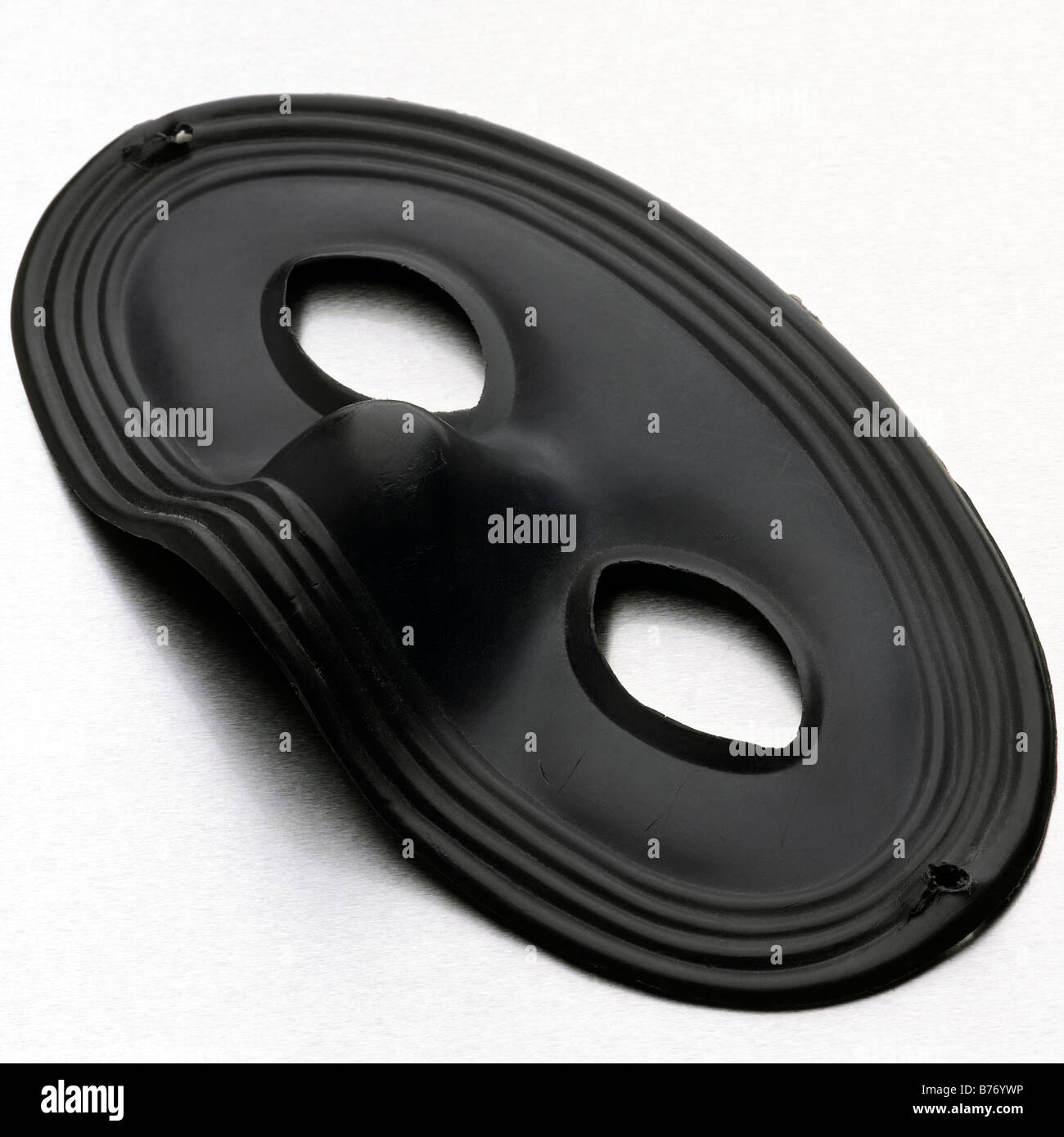 a black theater/carnival mask on white Stock Photo - Alamy