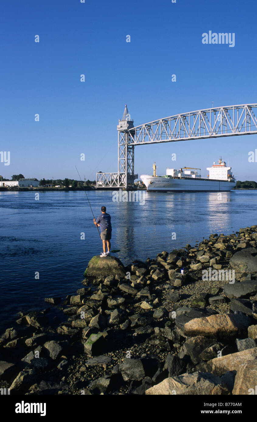 Freighter ship passing under Railroad bridge in the Cape Cod Canal with ...