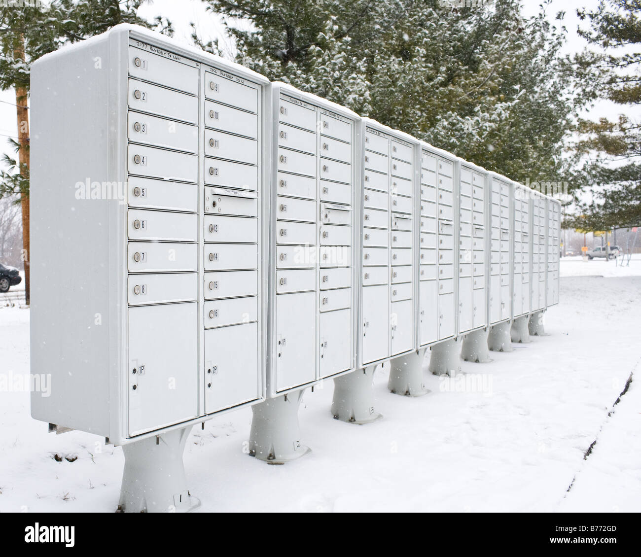 A row of mailboxes stand in the winter cold Stock Photo - Alamy