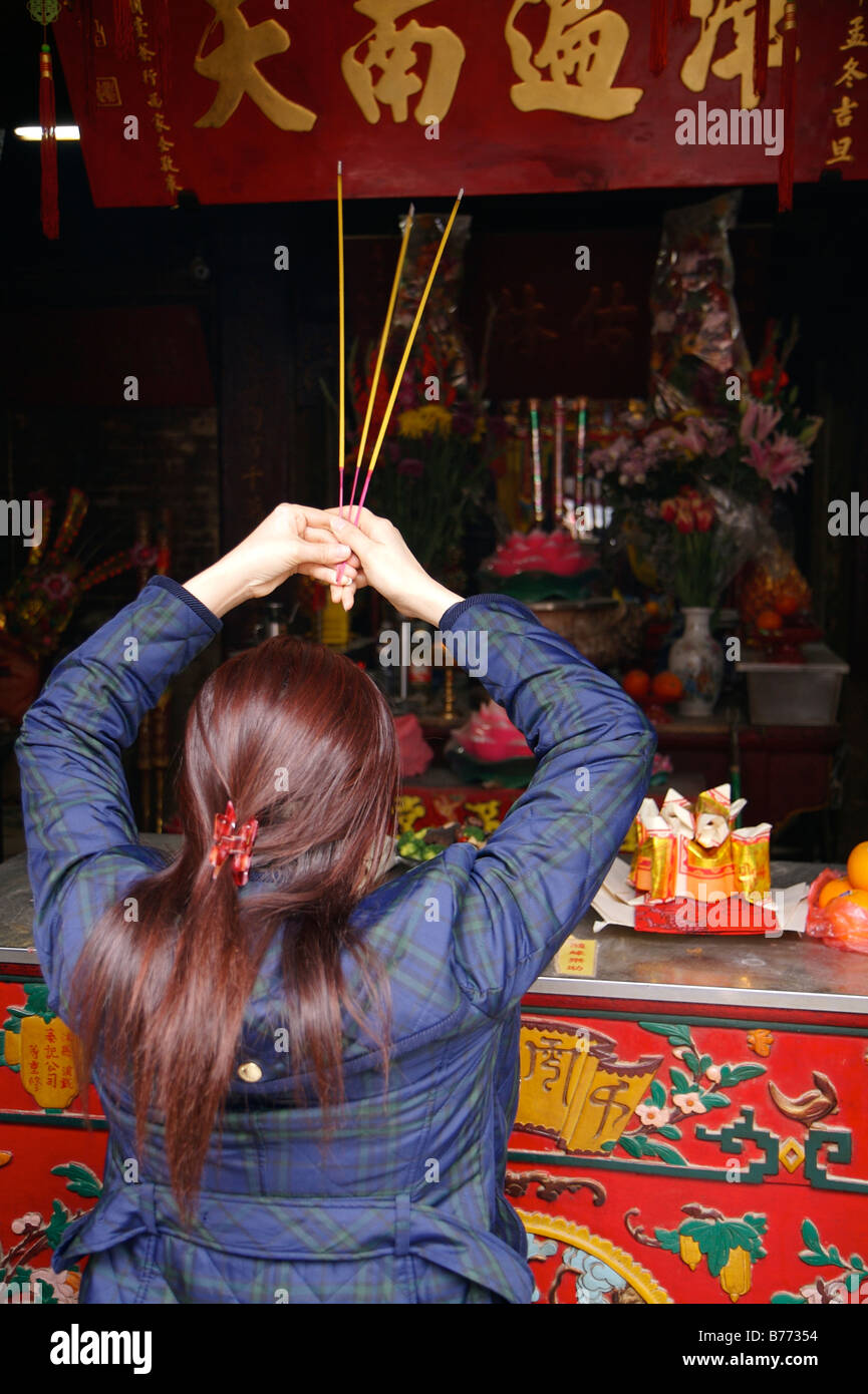 Woman joss sticks hi-res stock photography and images - Alamy