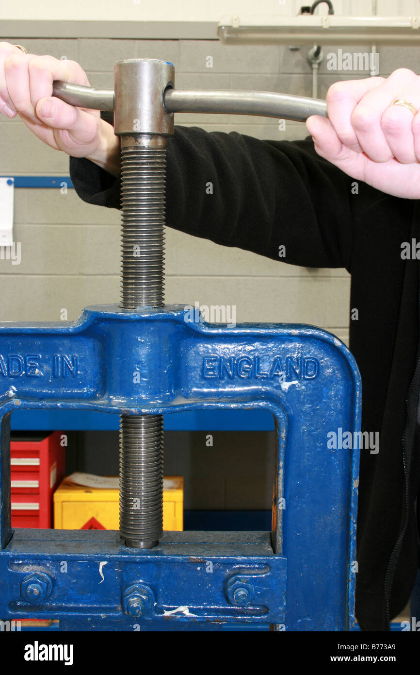 man tightening a workshop vice Stock Photo - Alamy