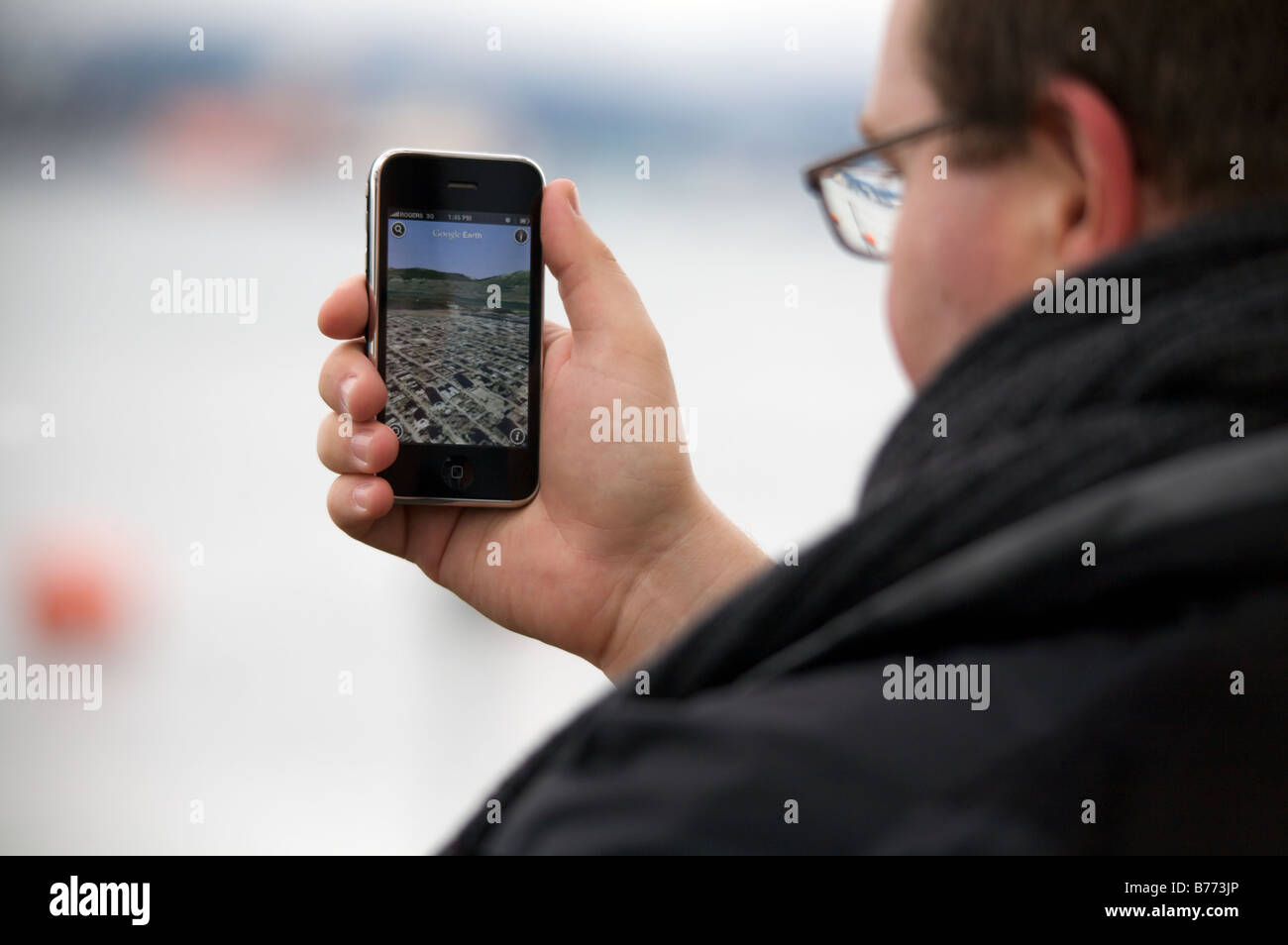 Man hand holding iPhone showing iPhone application Stock Photo - Alamy