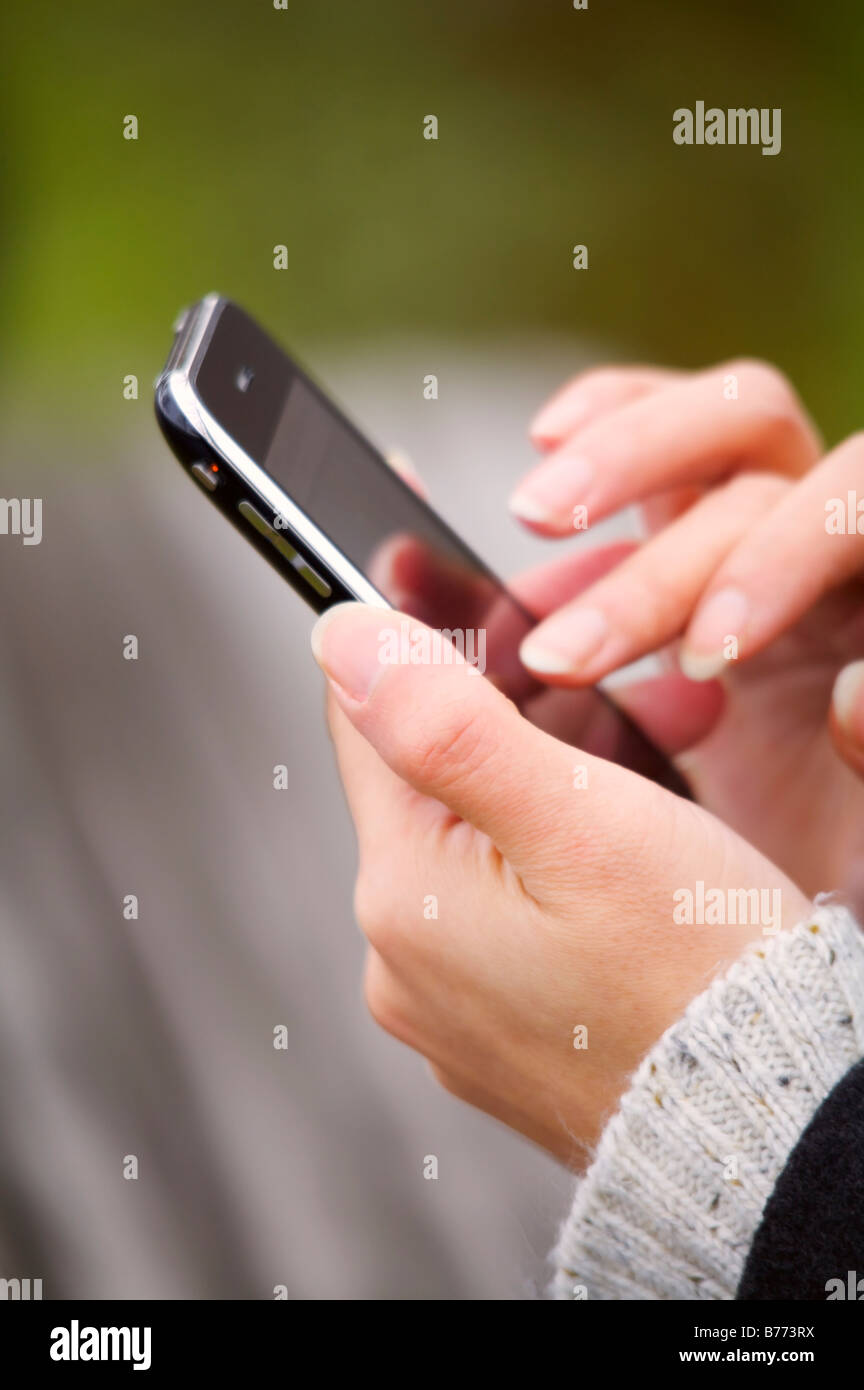 Man hand holding iPhone showing iPhone application Stock Photo - Alamy