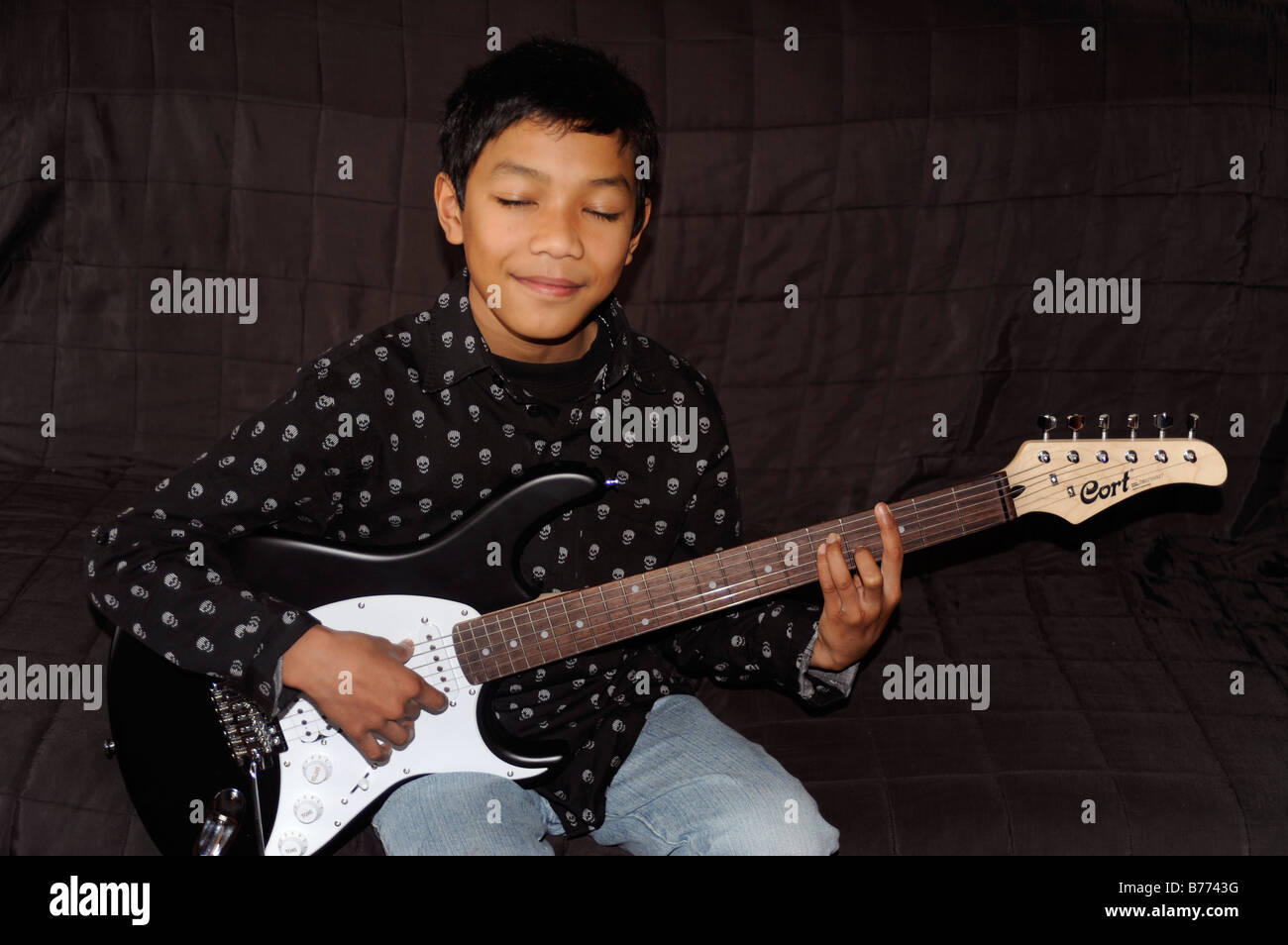 boy play electric guitar Stock Photo - Alamy