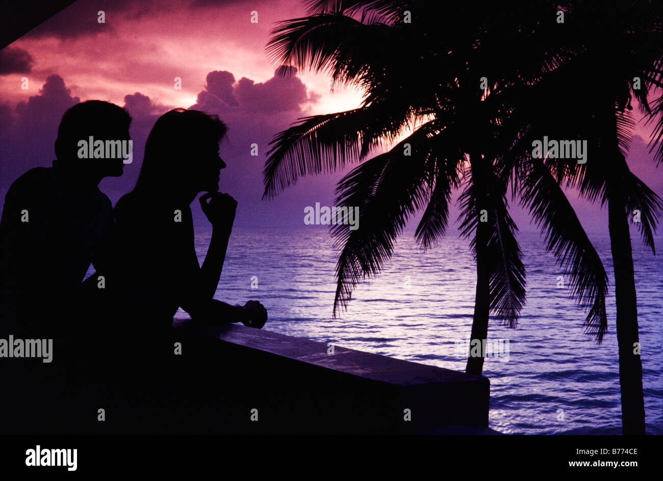 Romantic couple wachting sunrise together, Miami Stock Photo - Alamy