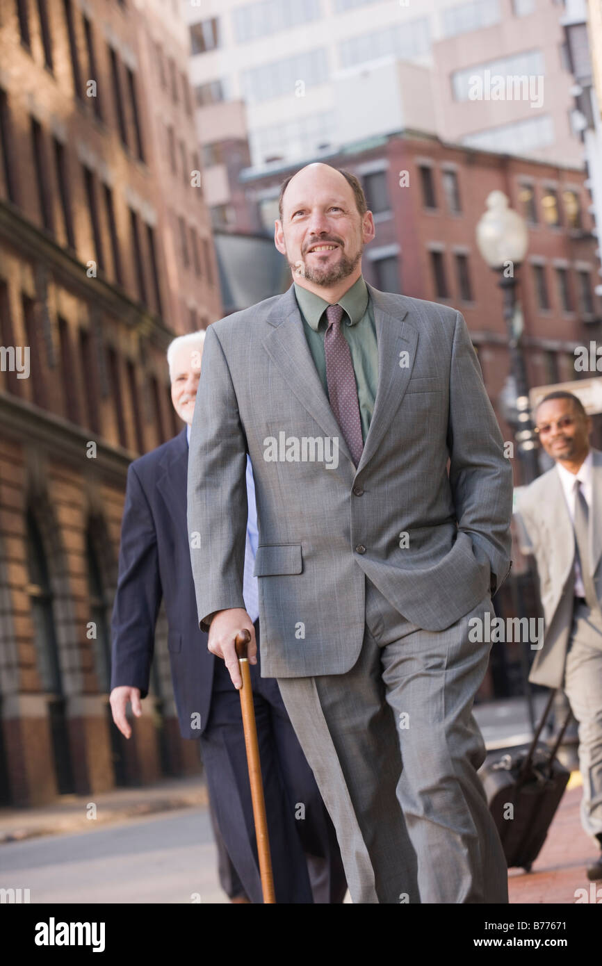 Two businessmen walking luggage hi-res stock photography and images - Alamy