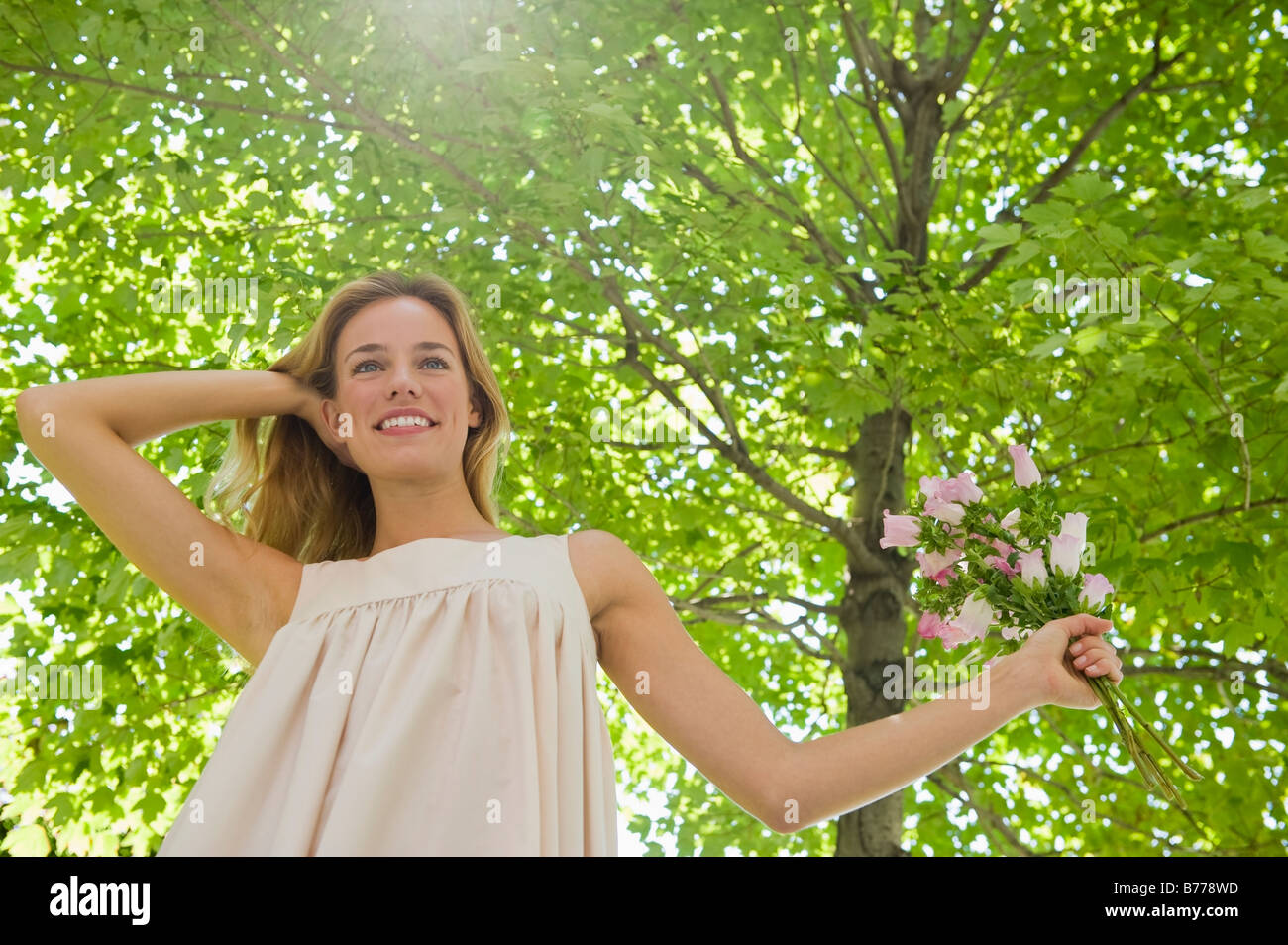 Woman under flowers hi-res stock photography and images - Alamy