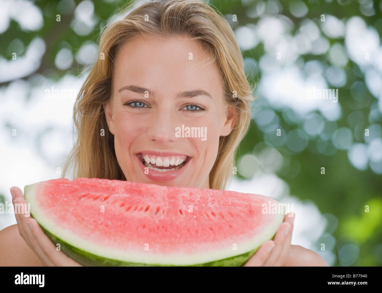 Woman eating watermelon Stock Photo - Alamy