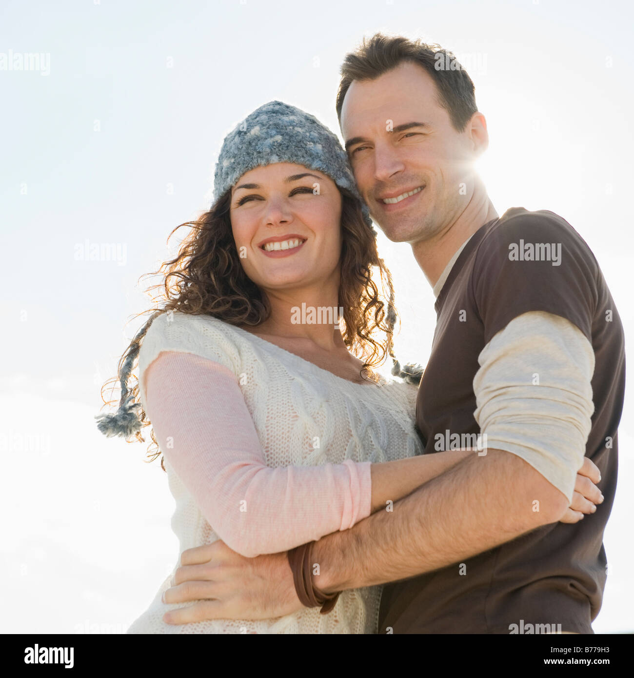 Portrait of couple hugging Stock Photo - Alamy