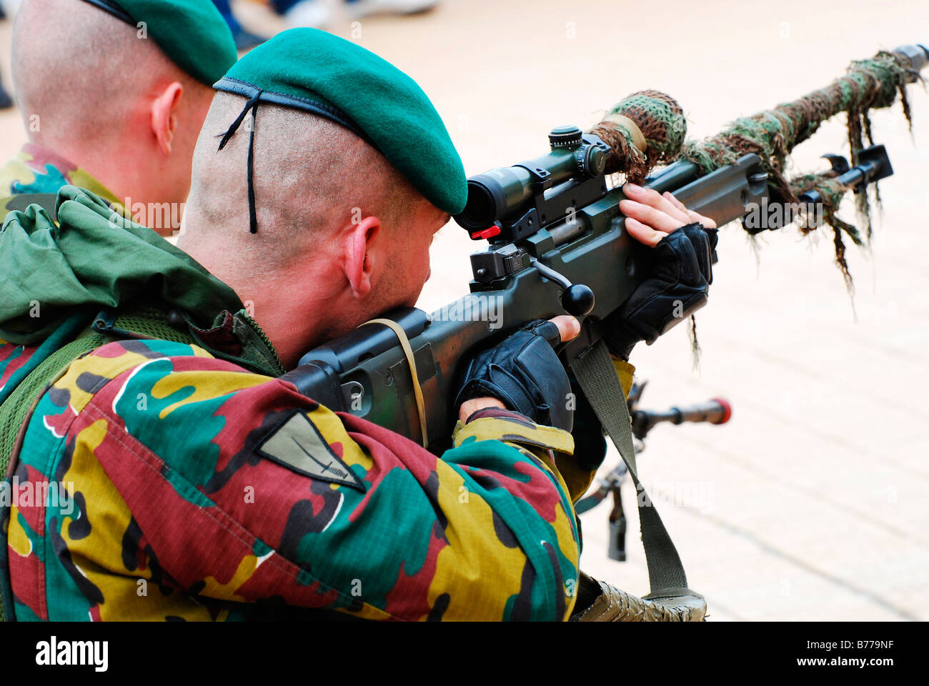 A Belgian paratrooper handling a sniper rifle in Ostend, Belgium during ...