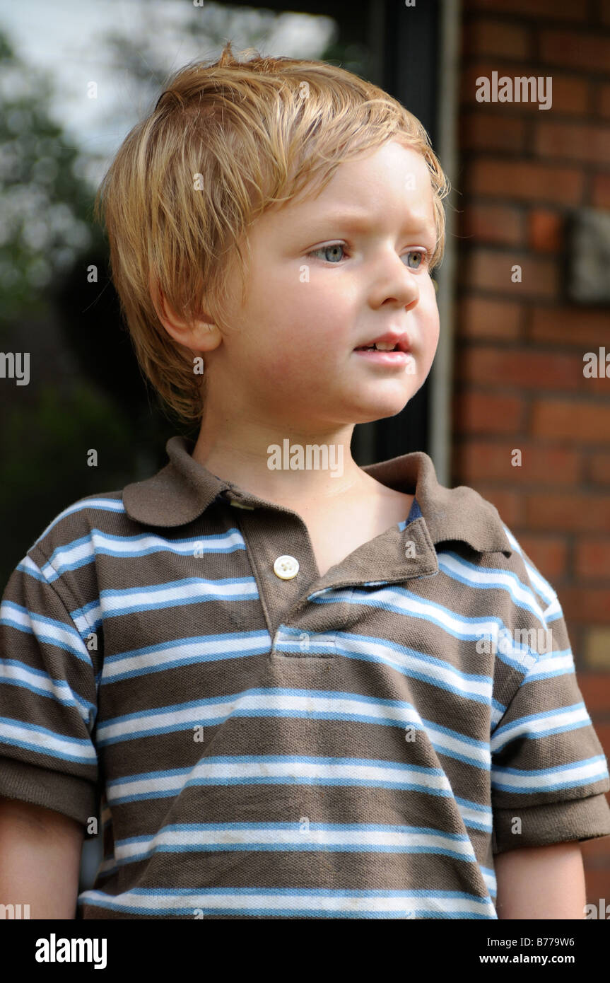 Boy on the stoop, straight-up Stock Photo - Alamy