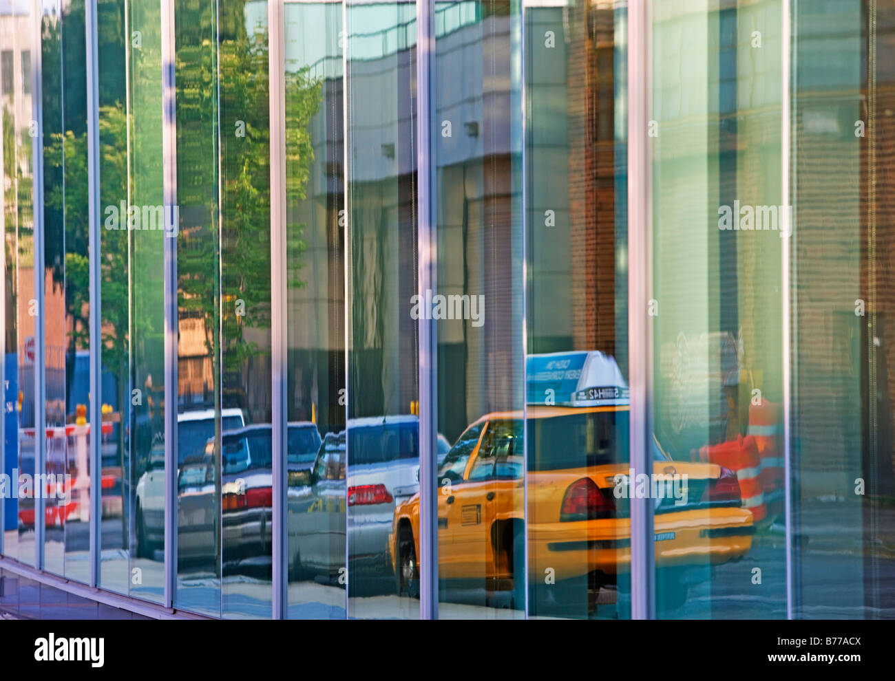 Reflection of taxi cab and cars on building Stock Photo - Alamy
