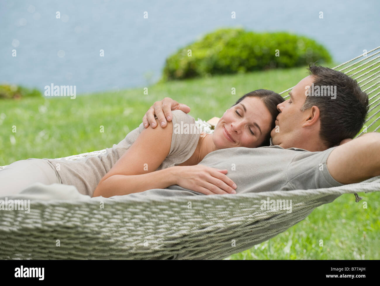 Couple laying hammock Stock Photo - Alamy