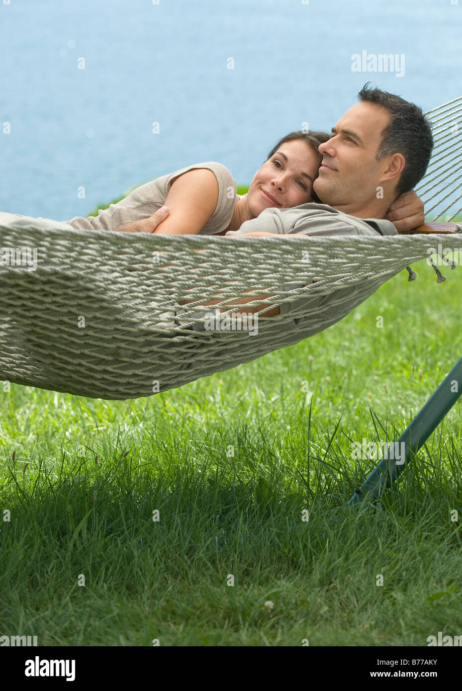 Couple laying hammock Stock Photo - Alamy