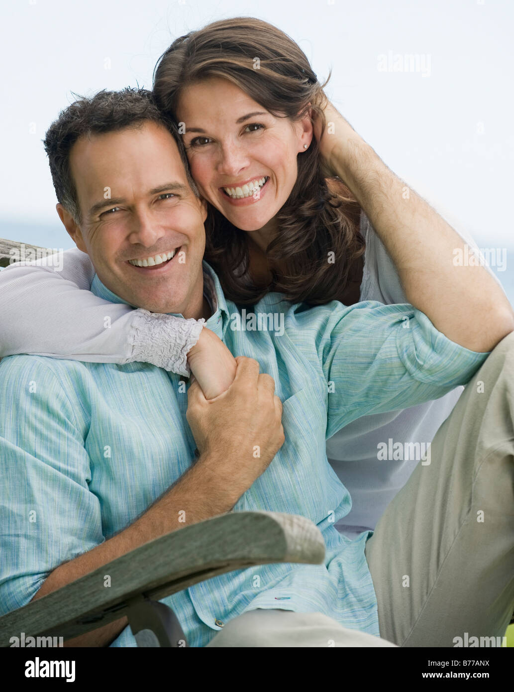 Portrait of couple hugging Stock Photo - Alamy