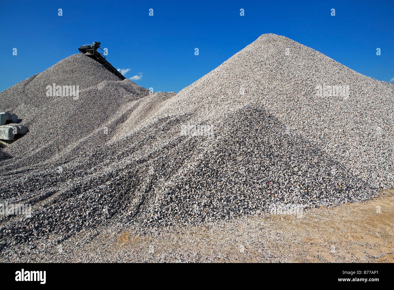 Gravel mounds concrete plant Stock Photo - Alamy