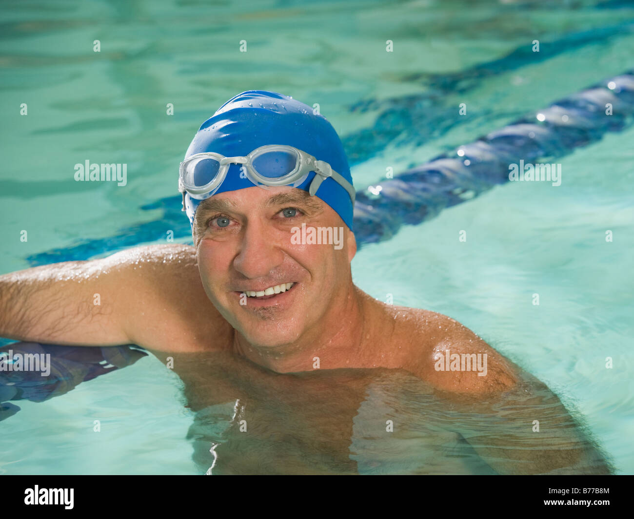 Man smiling swimming pool Stock Photo - Alamy