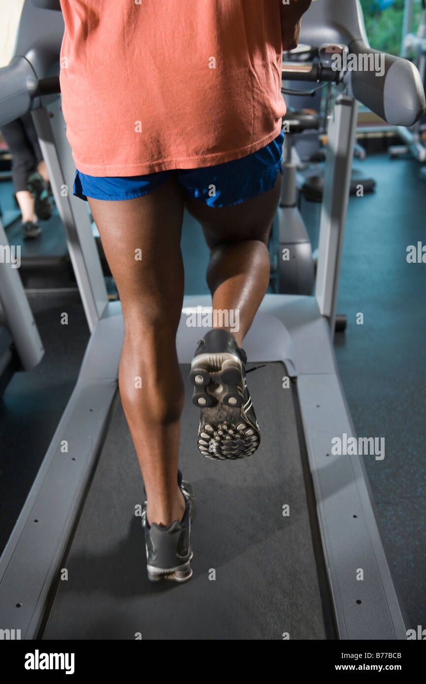 Man running on treadmill Stock Photo - Alamy