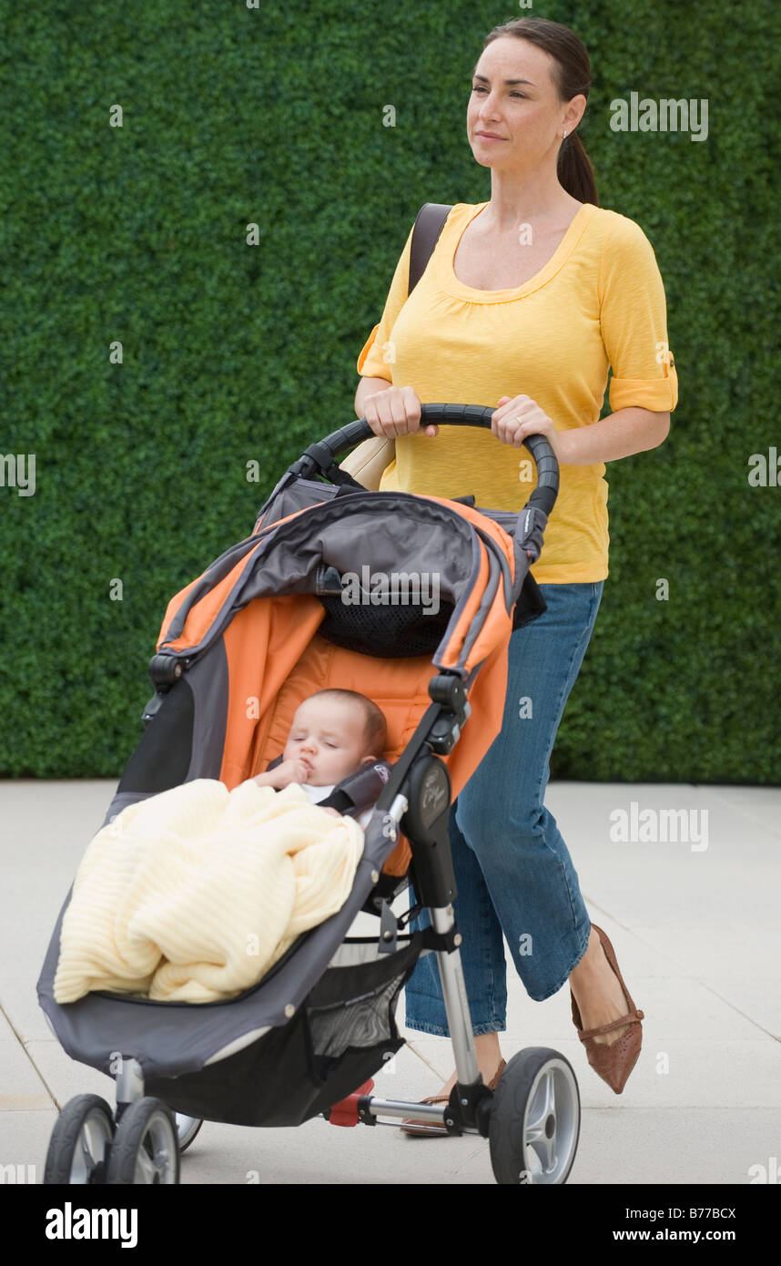 Mother walking baby son stroller Stock Photo - Alamy