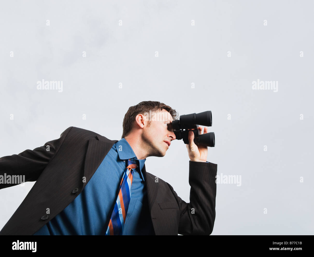 Businessman looking through binoculars Stock Photo - Alamy Businessman looking through binoculars Stock Photo - Alamy