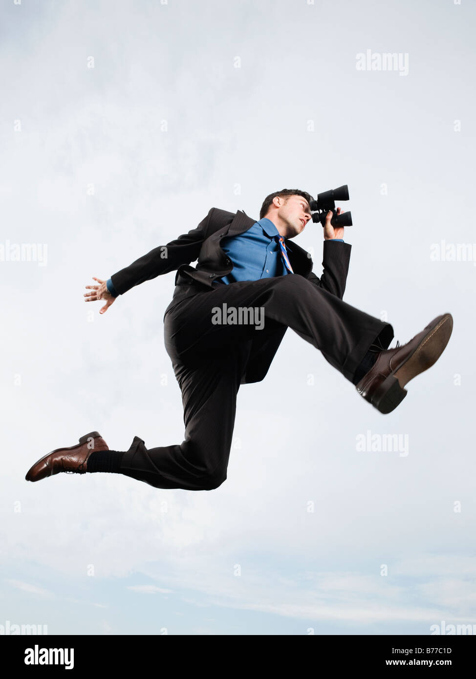 Businessman binoculars jumping mid-air Stock Photo - Alamy Businessman binoculars jumping mid-air Stock Photo - Alamy