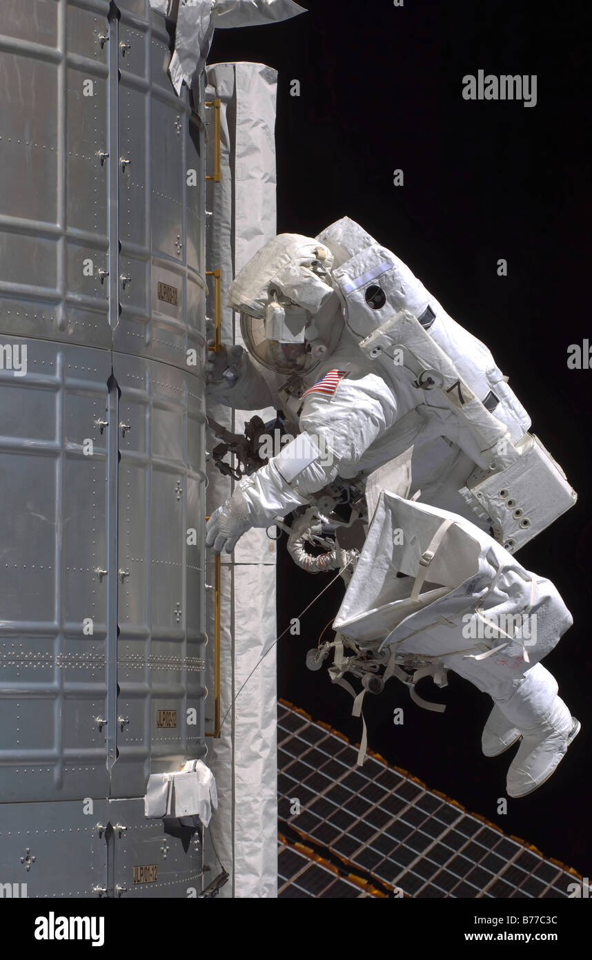 Astronaut participates in extravehicular activity Stock Photo - Alamy