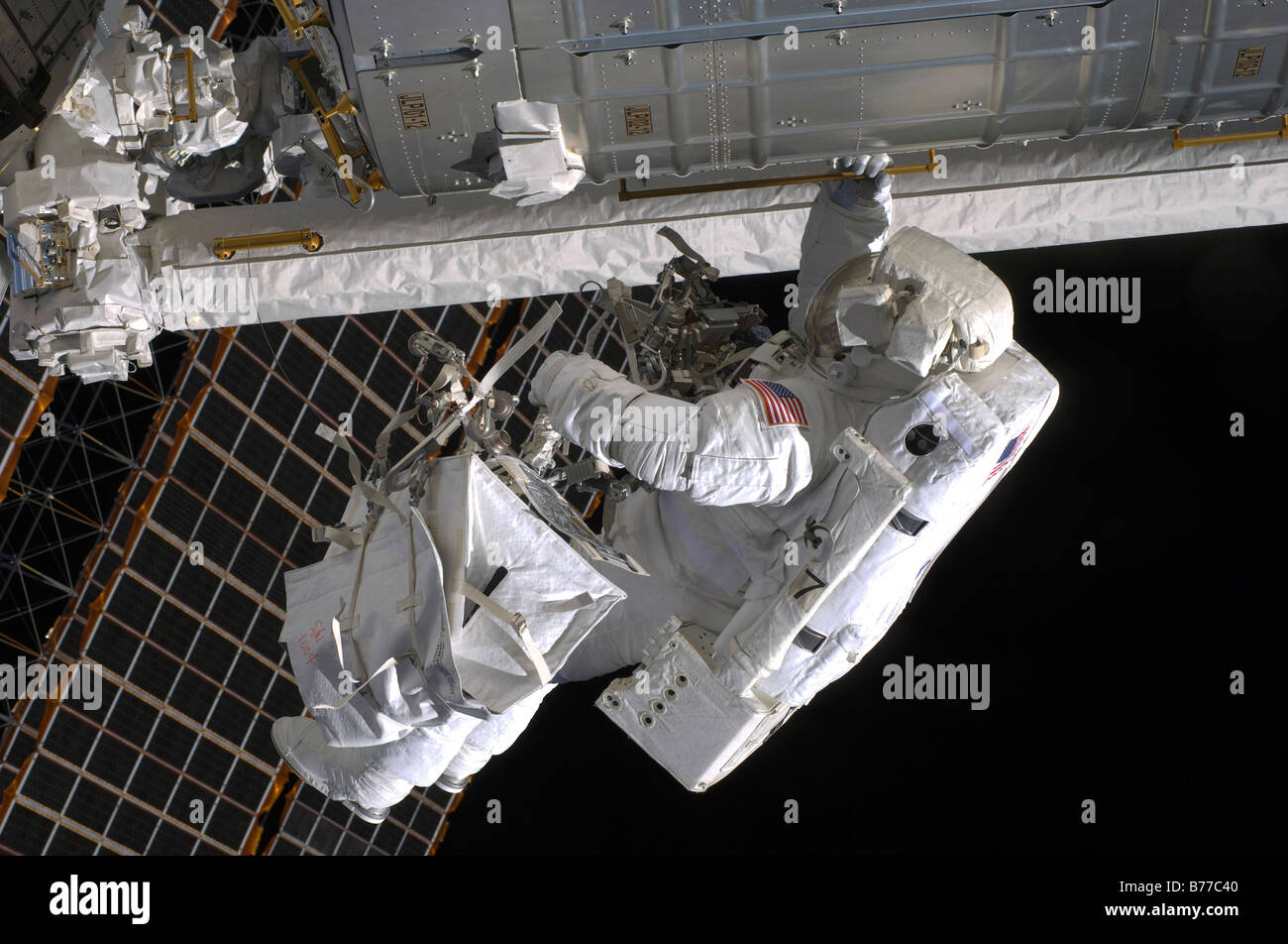 Astronaut participates in extravehicular activity Stock Photo - Alamy