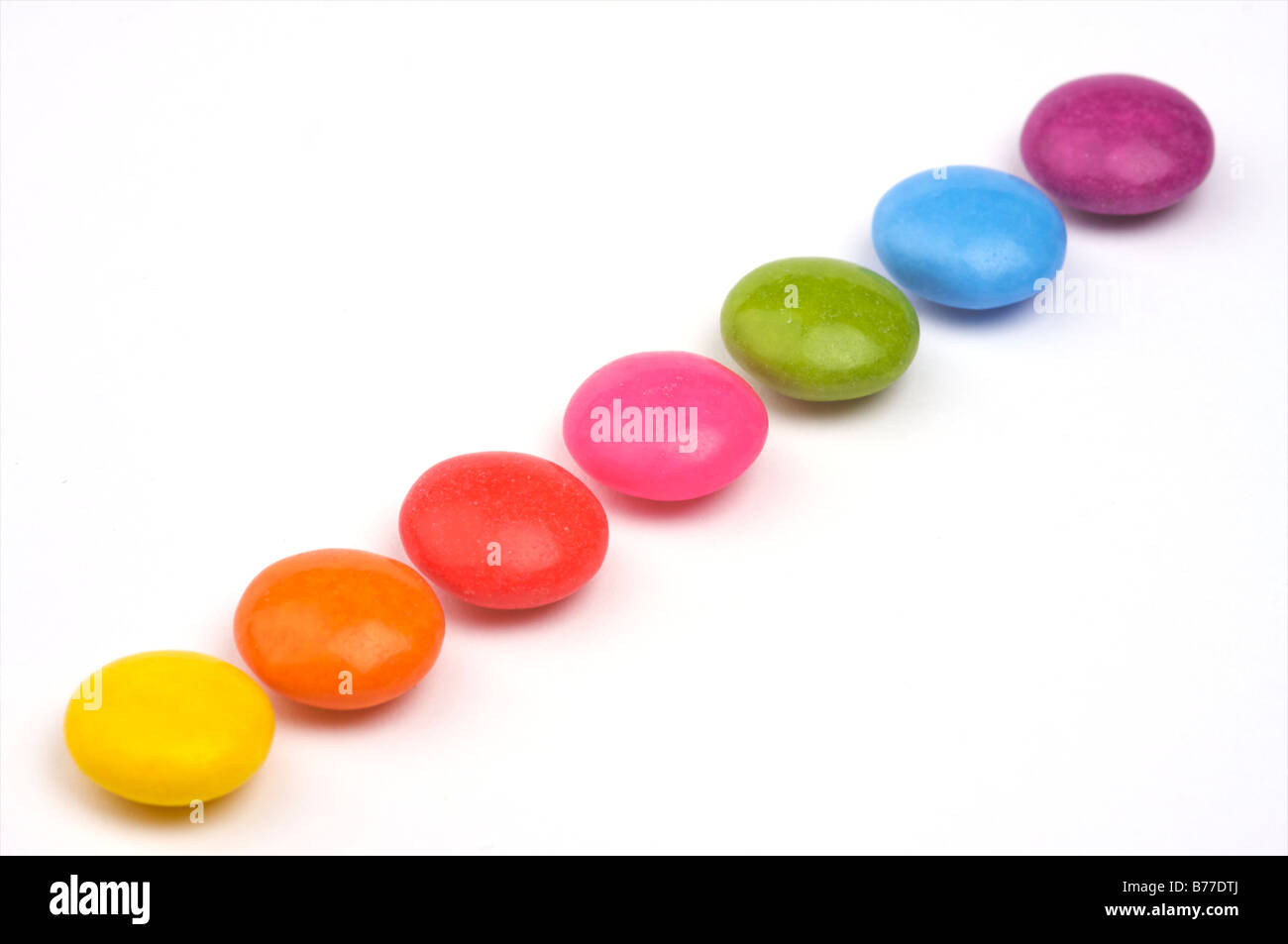 a rainbow of sugar coated candy Stock Photo - Alamy