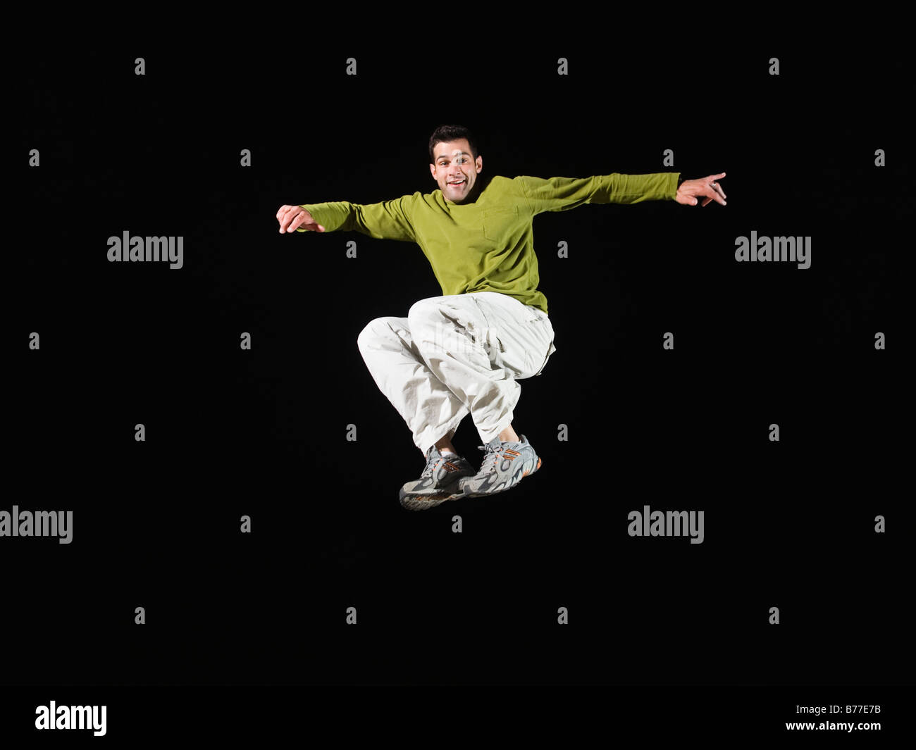 Portrait of man mid-air Stock Photo - Alamy