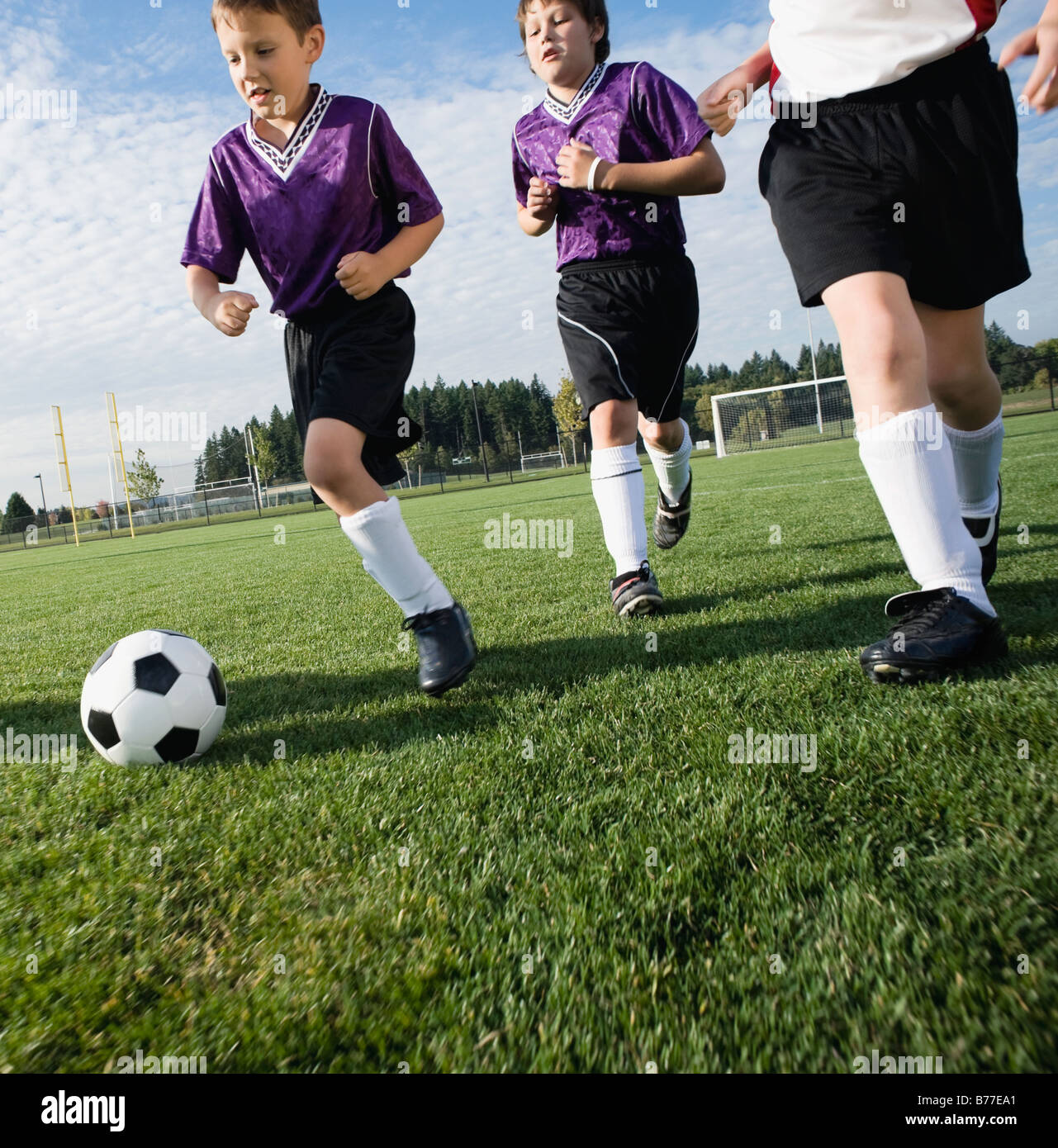 Boy chasing a ball hi-res stock photography and images - Alamy