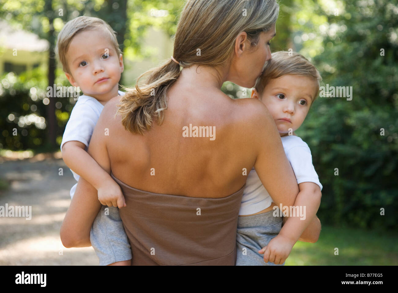 Mother two sons rear view hi-res stock photography and images - Alamy