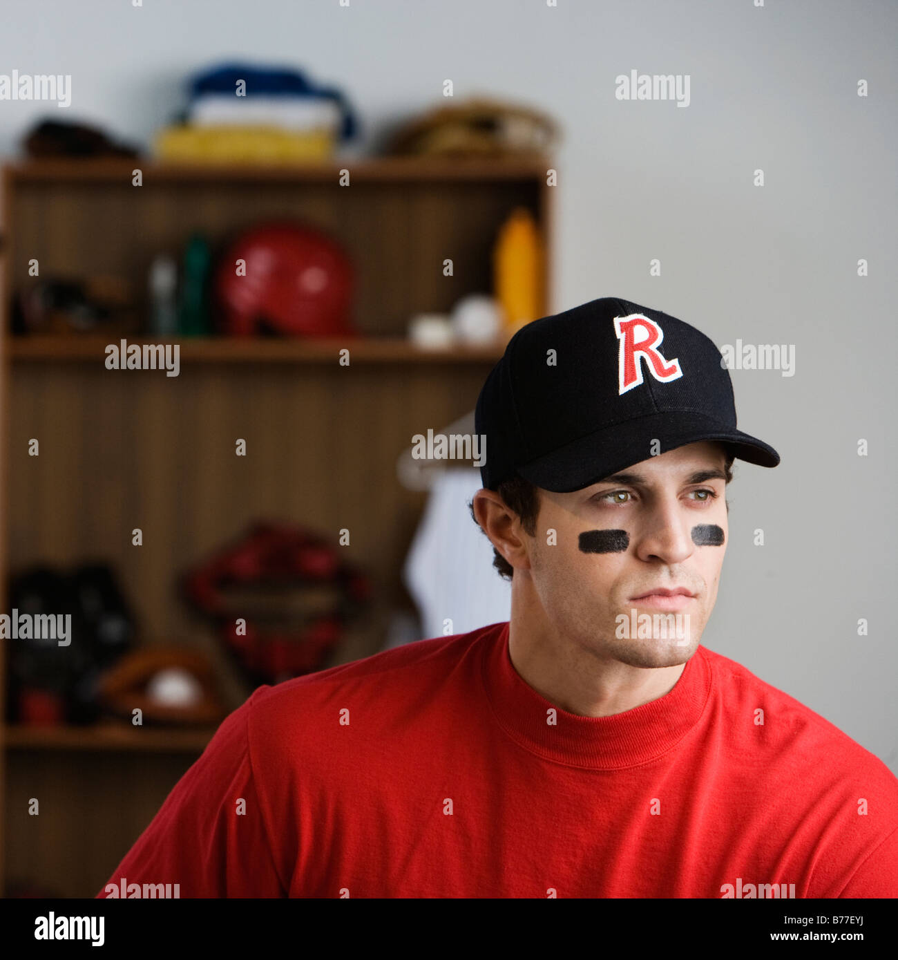 Baseball player looking pensive locker room Stock Photo - Alamy