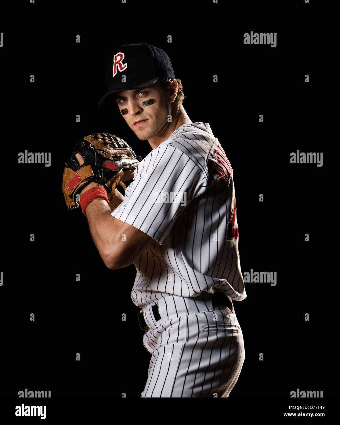 Portrait of pitcher preparing to throw ball Stock Photo - Alamy